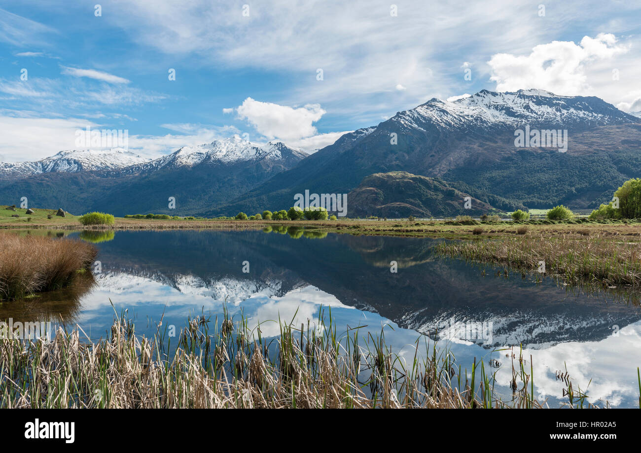 Mountain range reflected in a lake, Matukituki Valley, Mount Aspiring ...