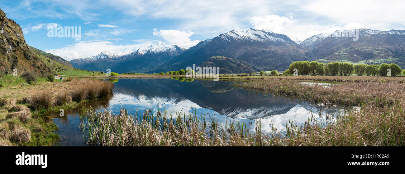 Mountain range reflected in a lake, Matukituki Valley, Mount Aspiring ...