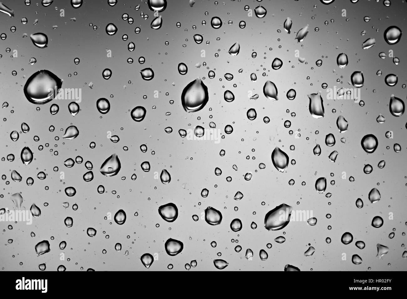 Water drops on a window pane, glass pane, window, rain, bad weather ...