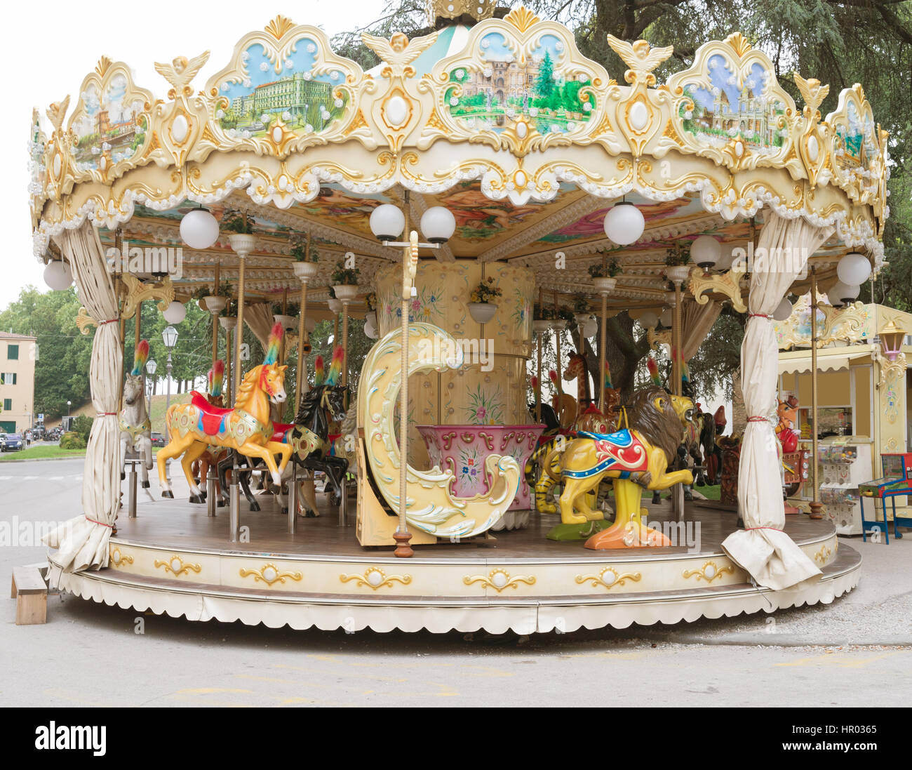 Colourful carousel in the Park in a sunny day Stock Photo - Alamy