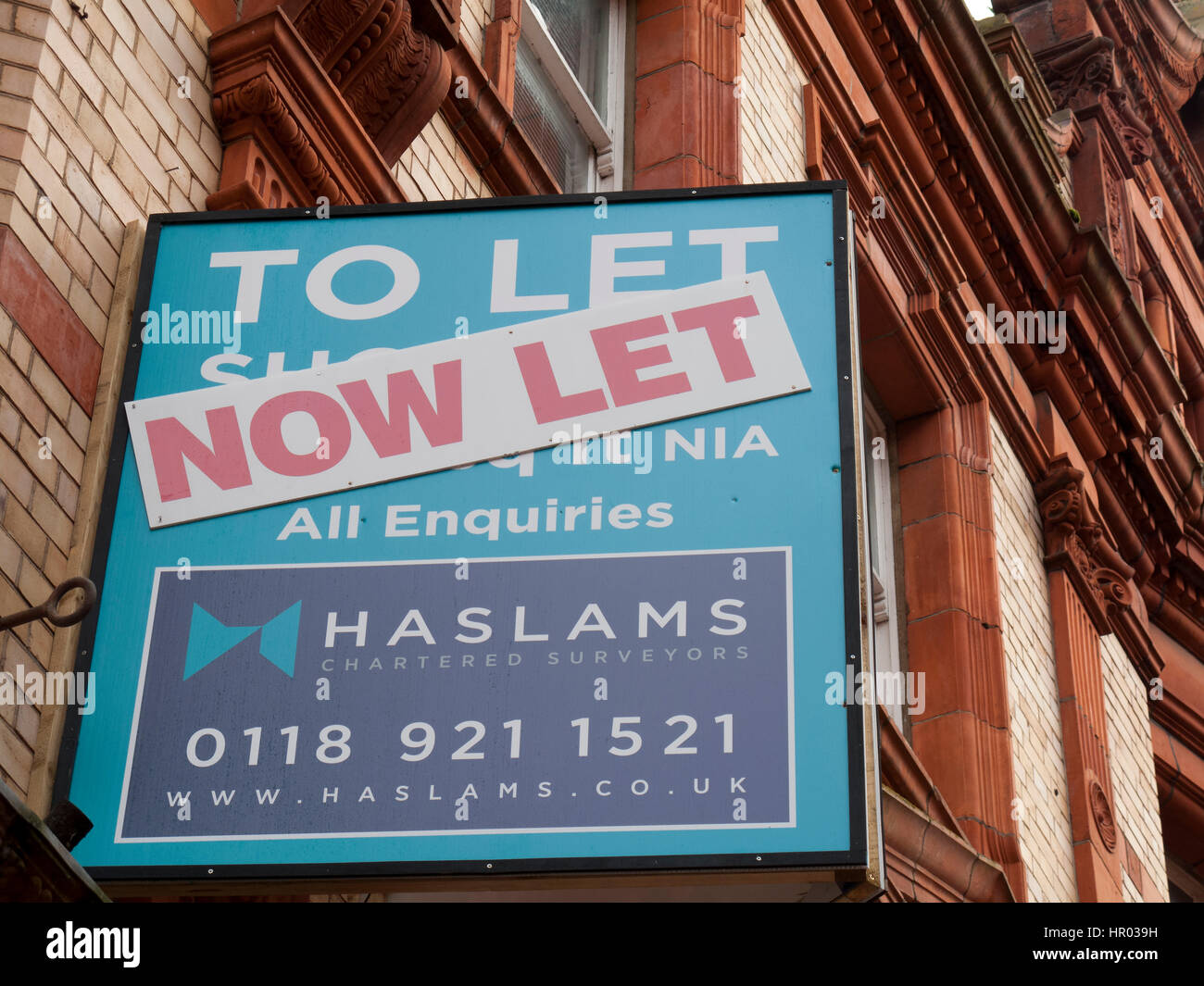 First floor offices to let sign over retail premises with now let ...