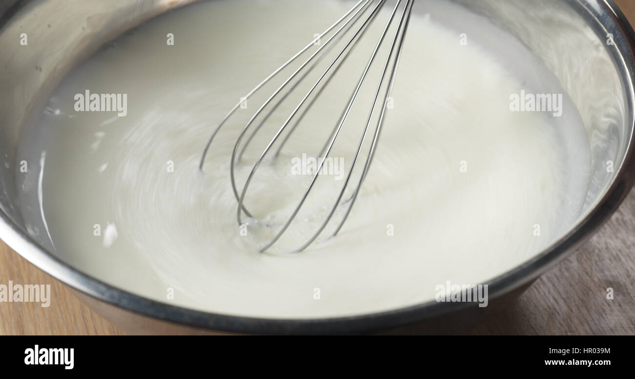 making liquid batter for crepes or blinis, 4k photo Stock Photo - Alamy