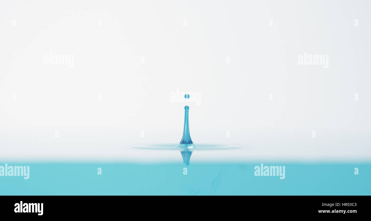 side view of bright blue water drop with accurate splash, 4k photo ...