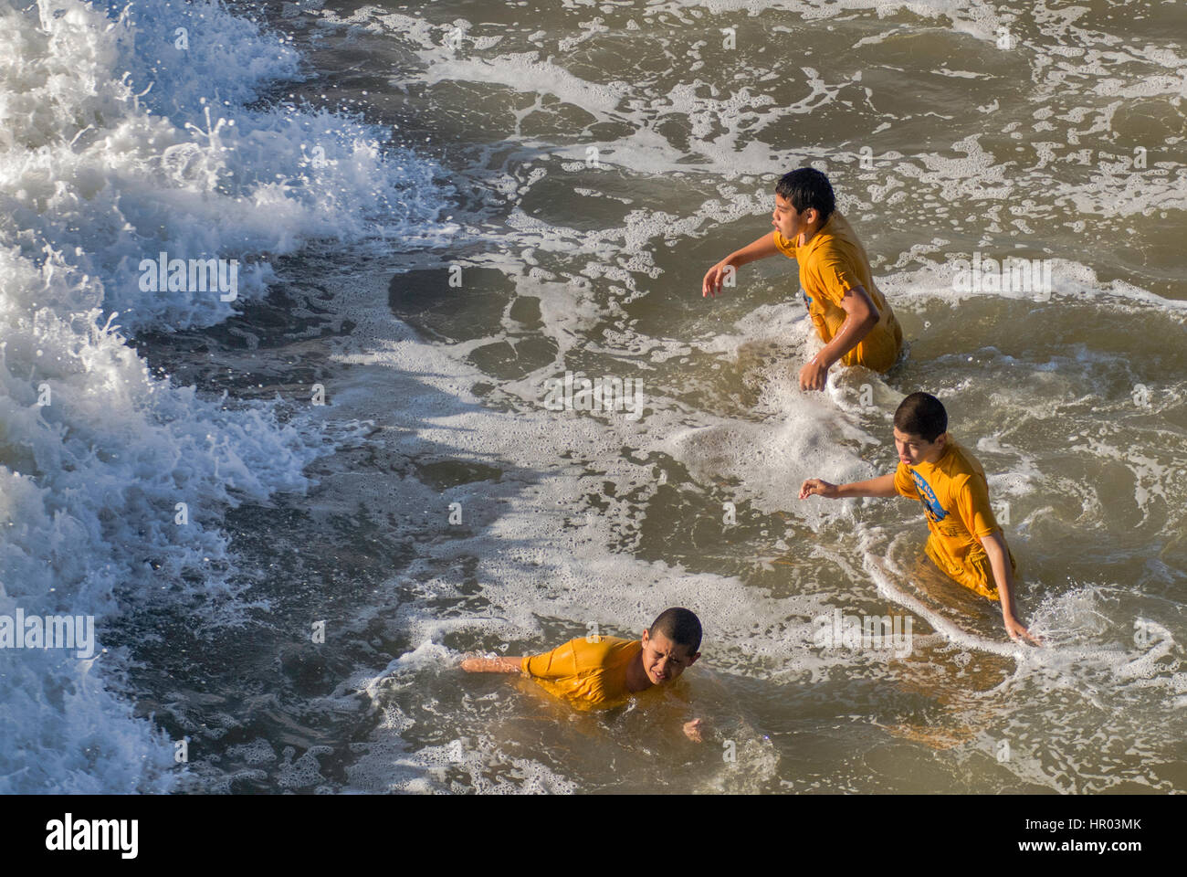 Boys swimming at Pacific Ocean beach in Santa Monica, California, USA ...