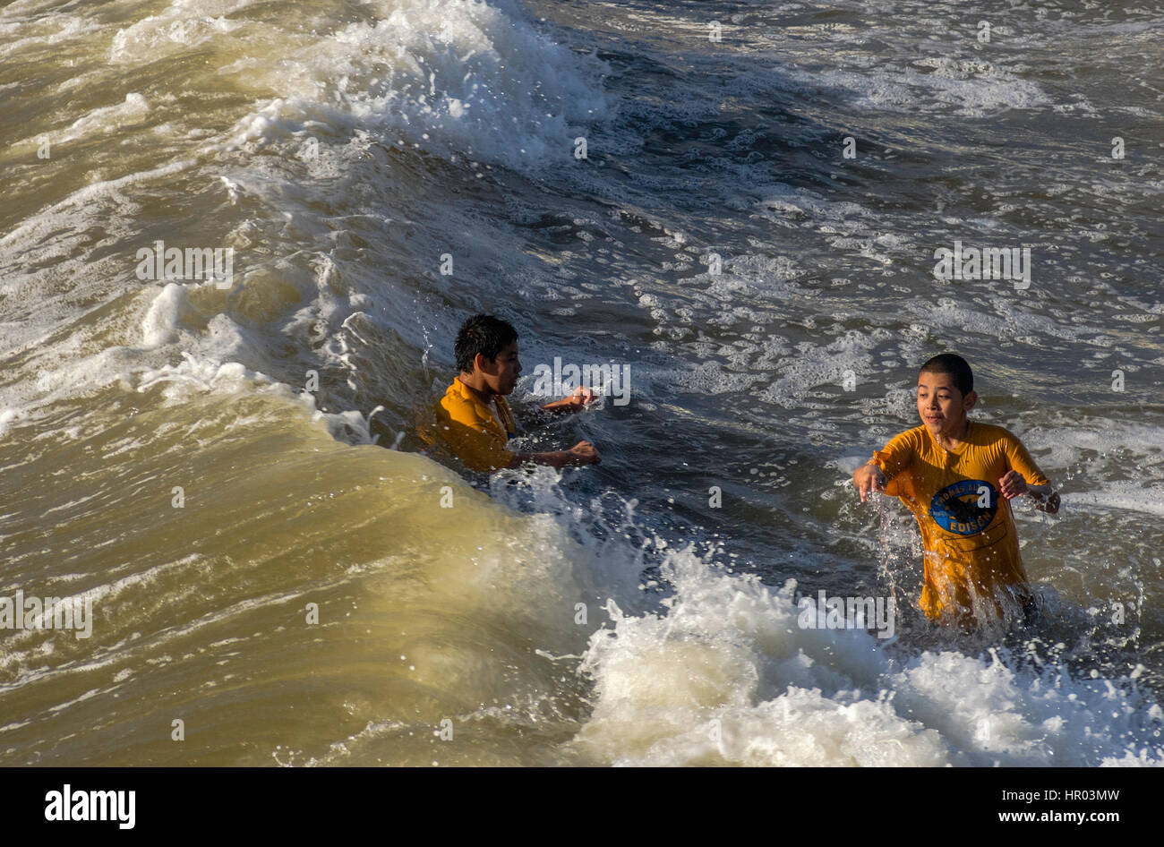 Boys swimming at Pacific Ocean beach in Santa Monica, California, USA ...