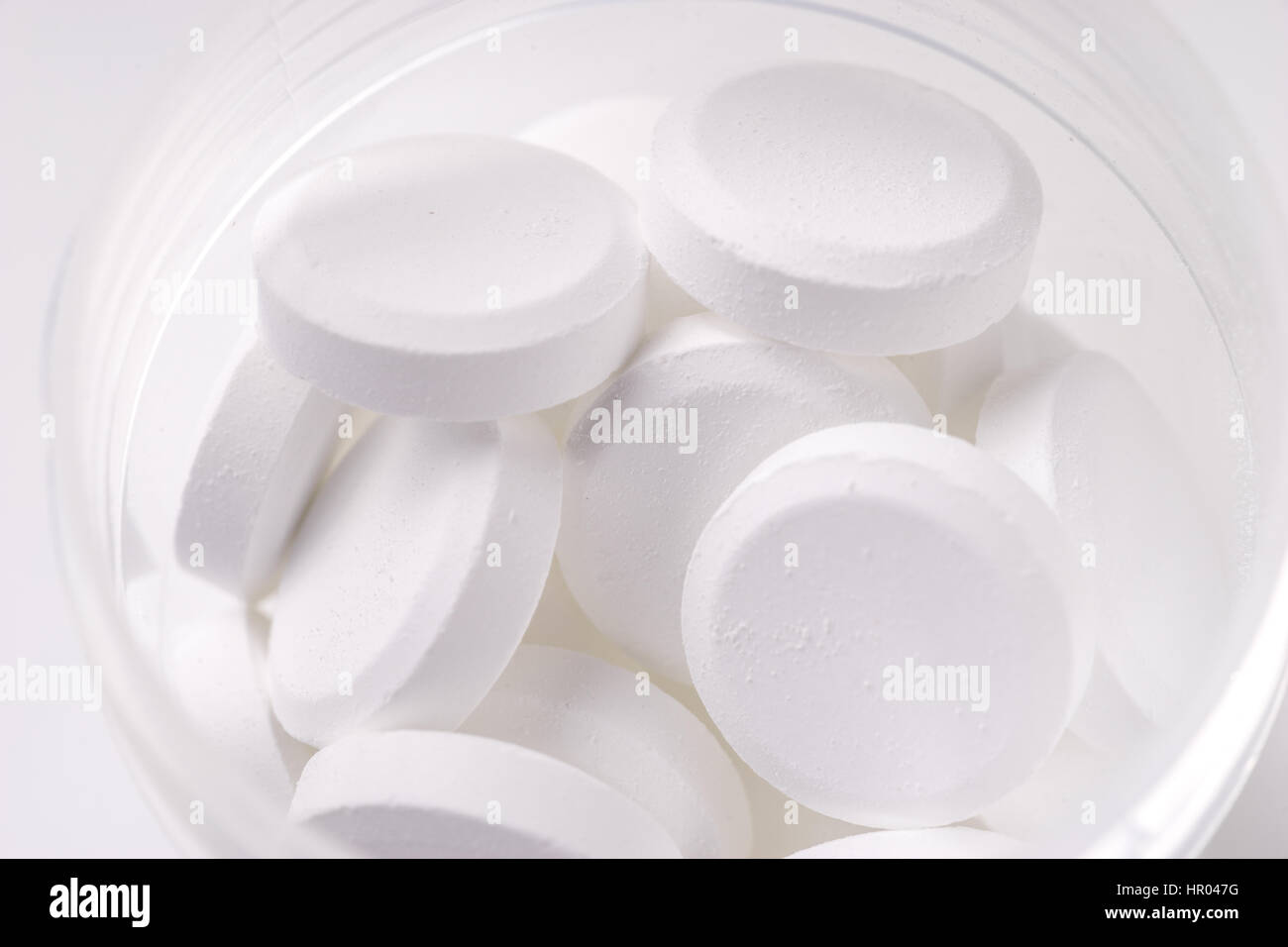 pile of white tablets isolated on white background Stock Photo - Alamy