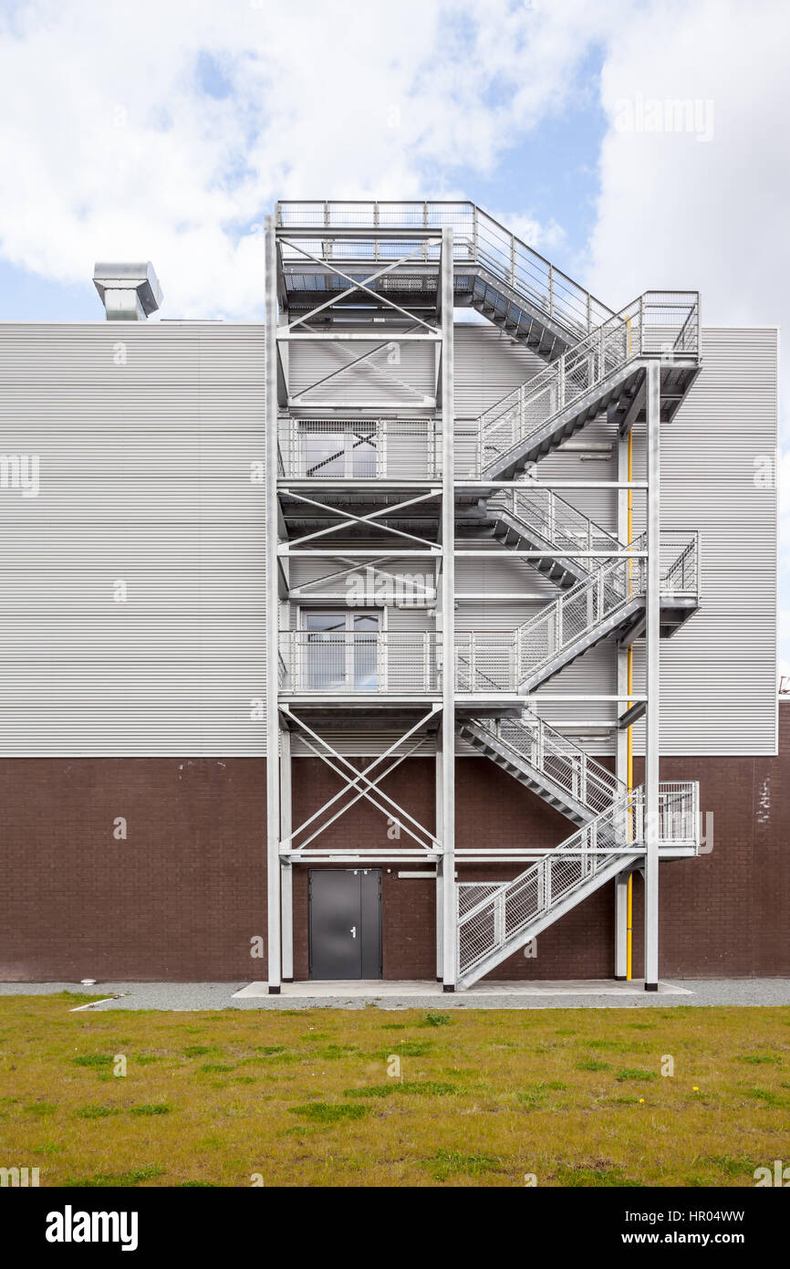 an tall building there is an emergency staircase Stock Photo - Alamy