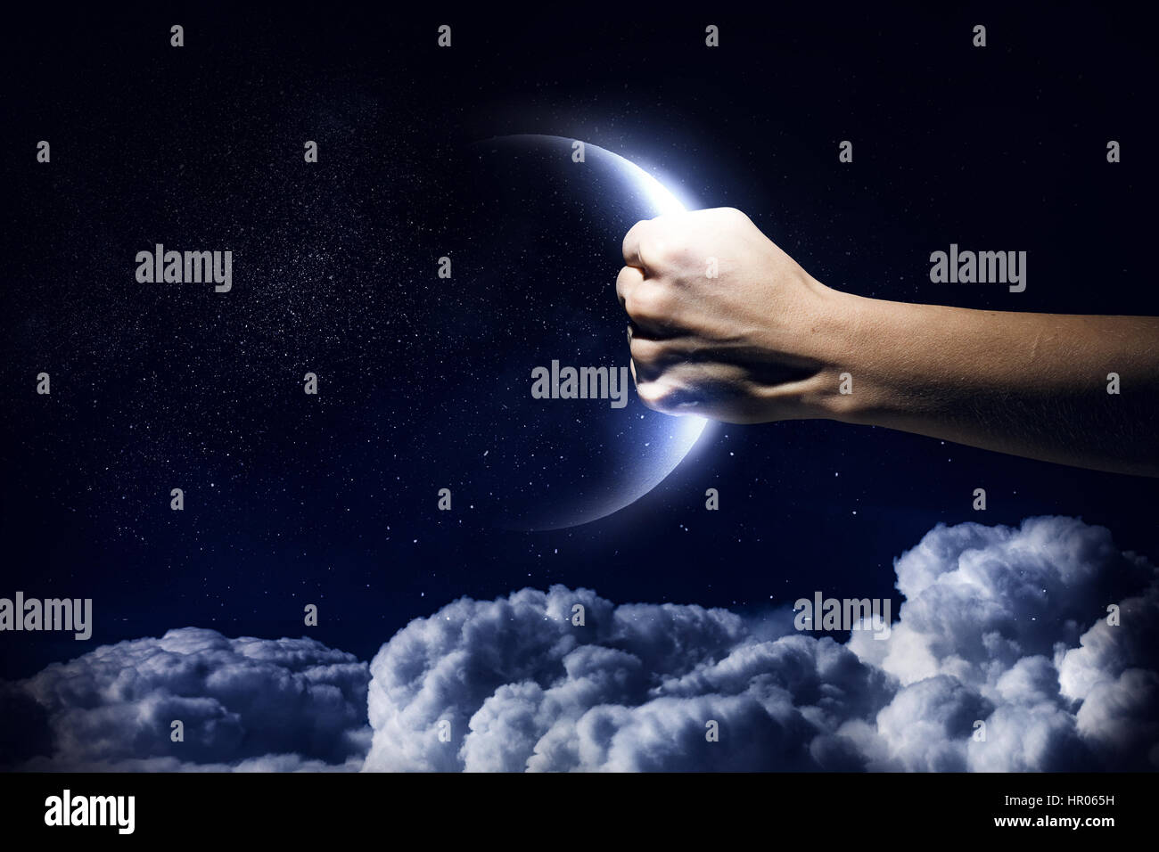 Moon in hand . Mixed media Stock Photo - Alamy