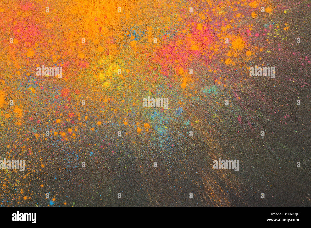 Holi colours on black background Stock Photo - Alamy