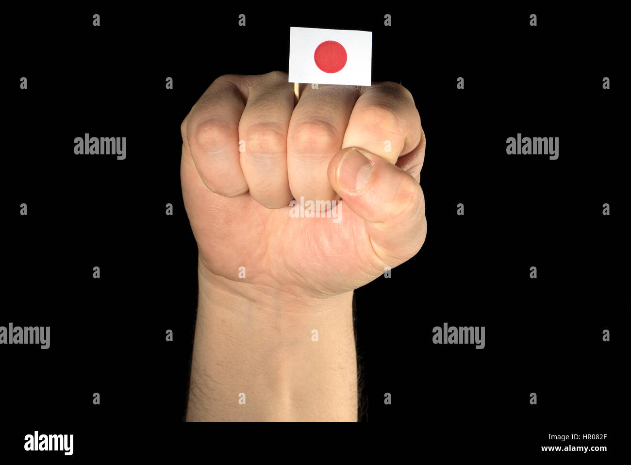 Man hand fist with Japanese flag isolated on black background Stock ...