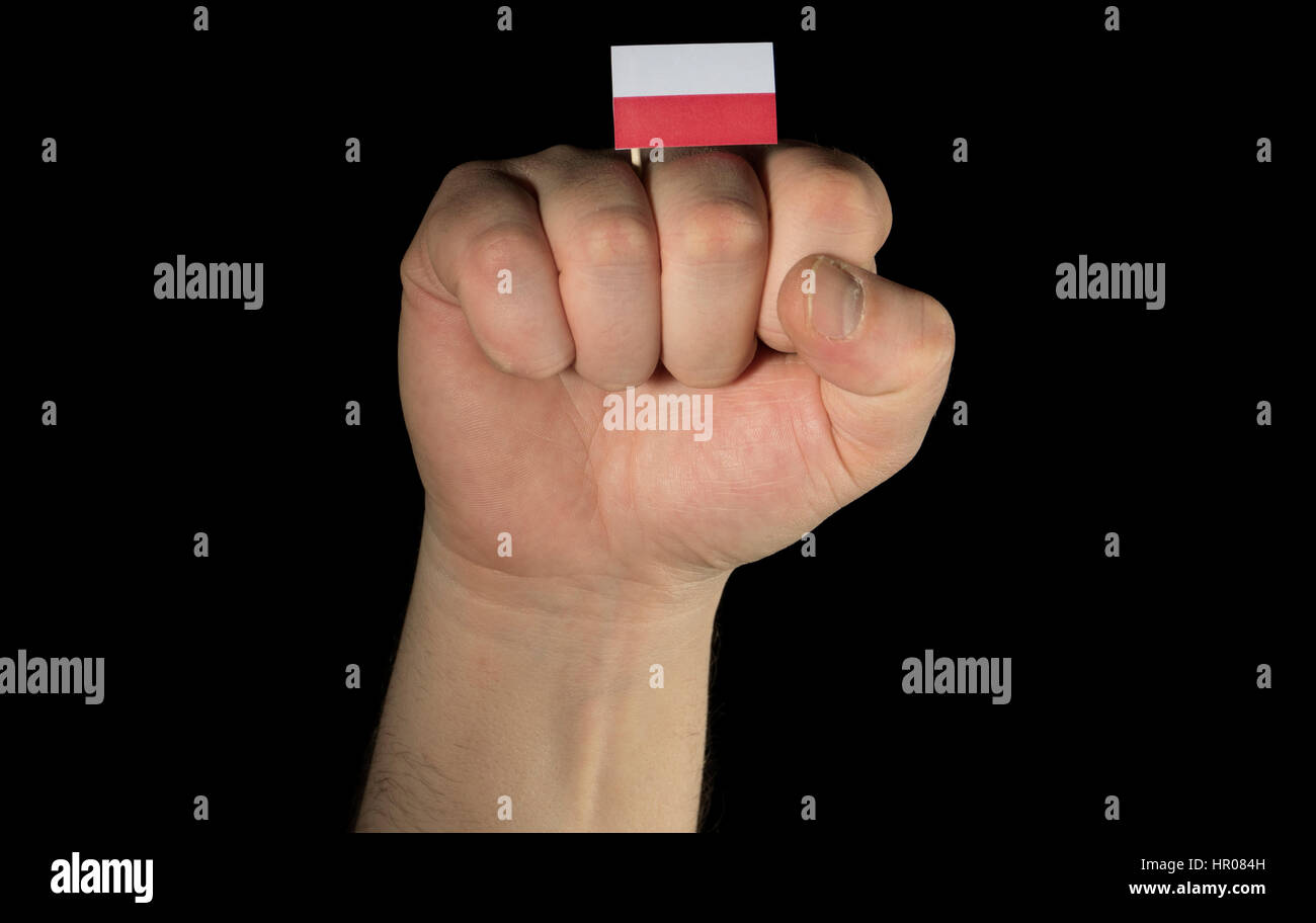 Man hand fist with Polish flag isolated on black background Stock Photo ...