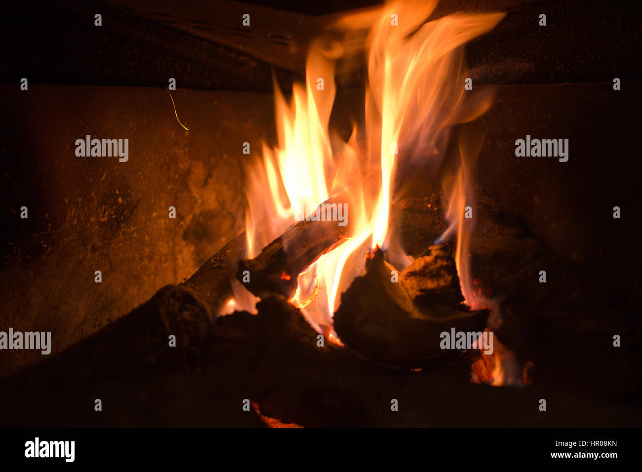 Chimney flames, fire in a chimney on dark background Stock Photo - Alamy