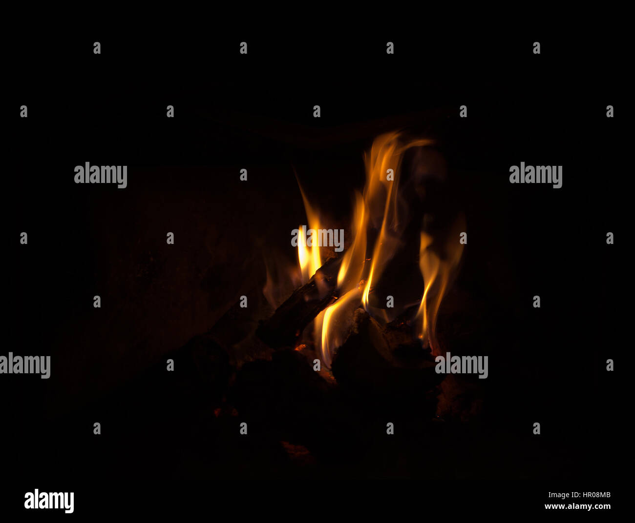 Chimney flames, fire in a chimney on dark background Stock Photo - Alamy