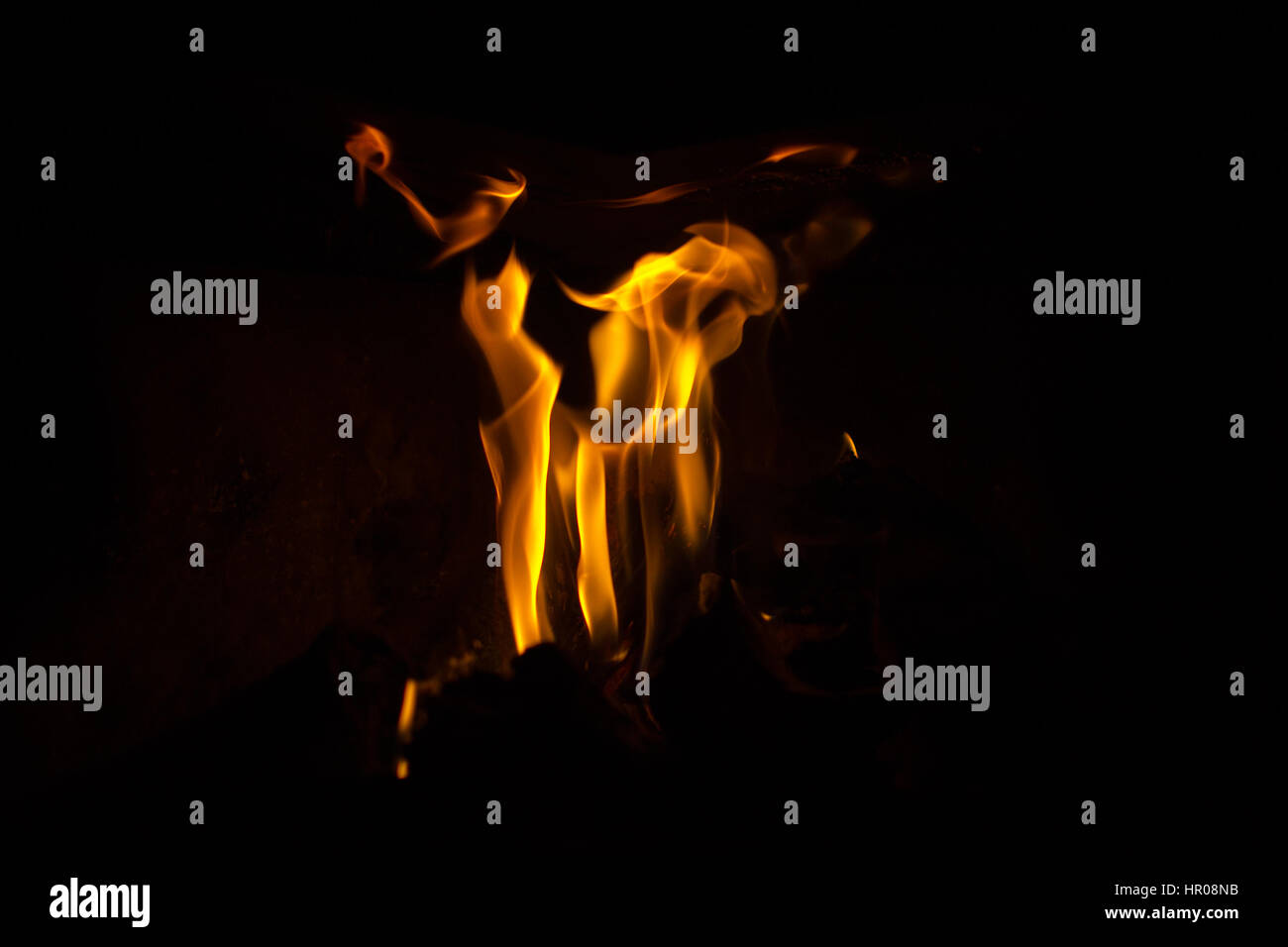 Chimney flames, fire in a chimney on dark background Stock Photo - Alamy