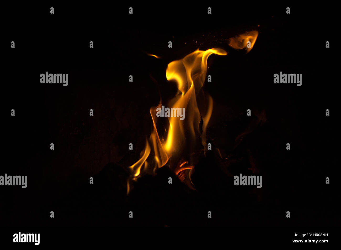 Chimney flames, fire in a chimney on dark background Stock Photo - Alamy