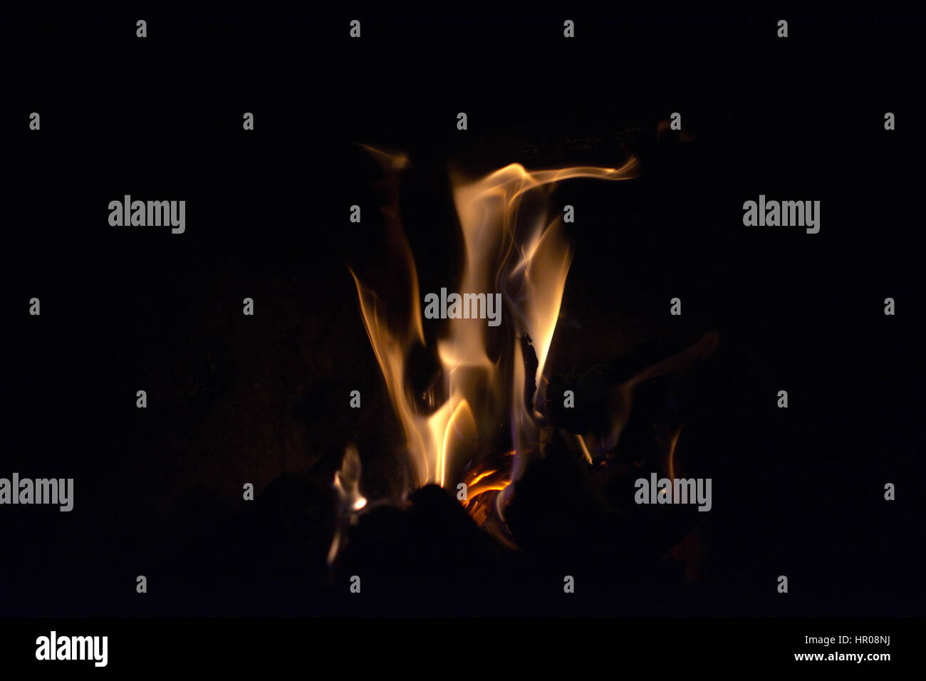 Chimney flames, fire in a chimney on dark background Stock Photo - Alamy