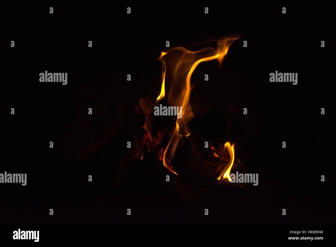 Chimney flames, fire in a chimney on dark background Stock Photo - Alamy