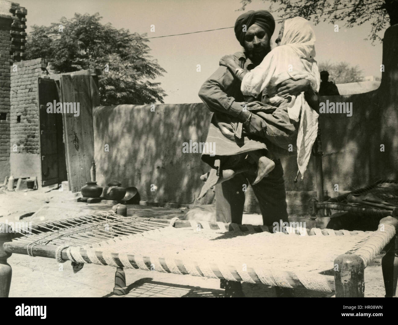 Indian Jawan helping an old Pakistani woman, Sialkot, India Stock Photo ...