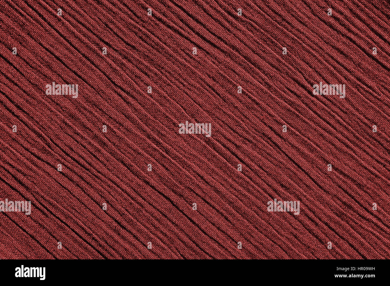 Red crinkled fabric with irregular diagonal lines textile abstract ...