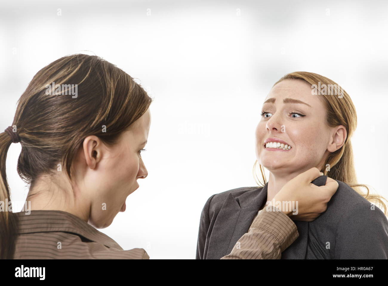 Two angry businesspeople fighting isolated hi-res stock photography and ...