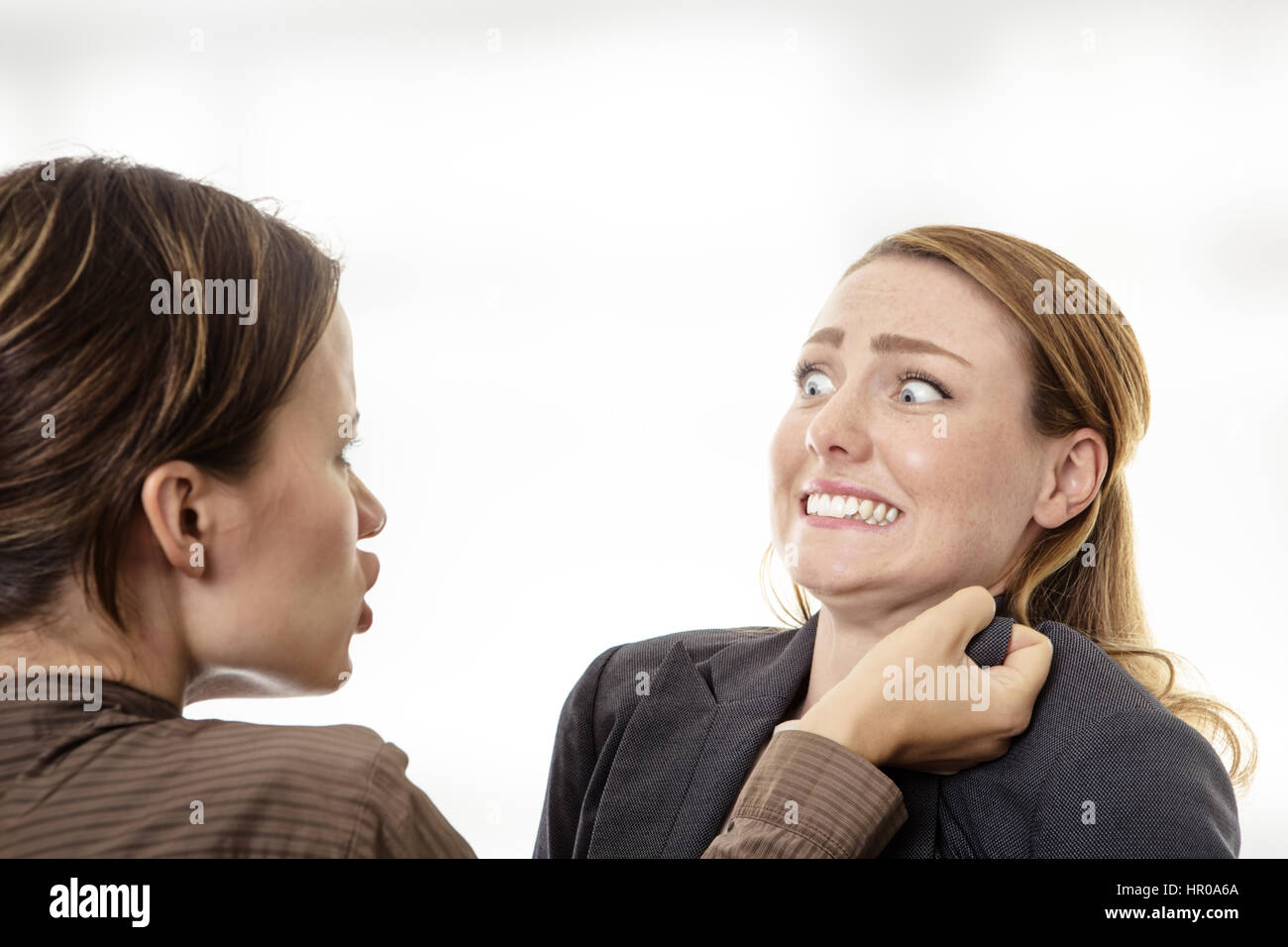 Two angry businesspeople fighting isolated hi-res stock photography and ...
