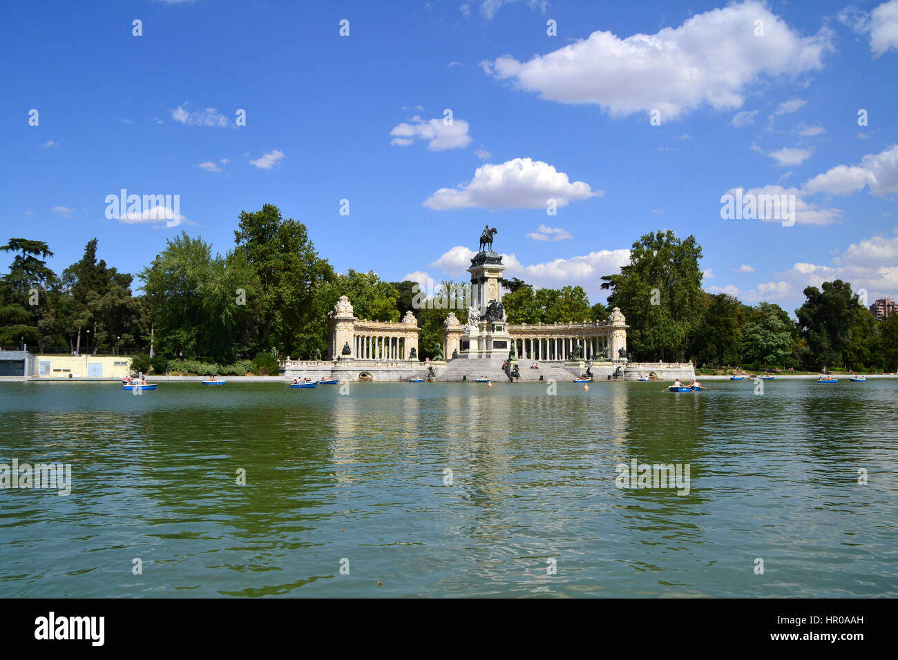 People enjoying a boat ride on the pond in El Retiro Park in Madrid ...