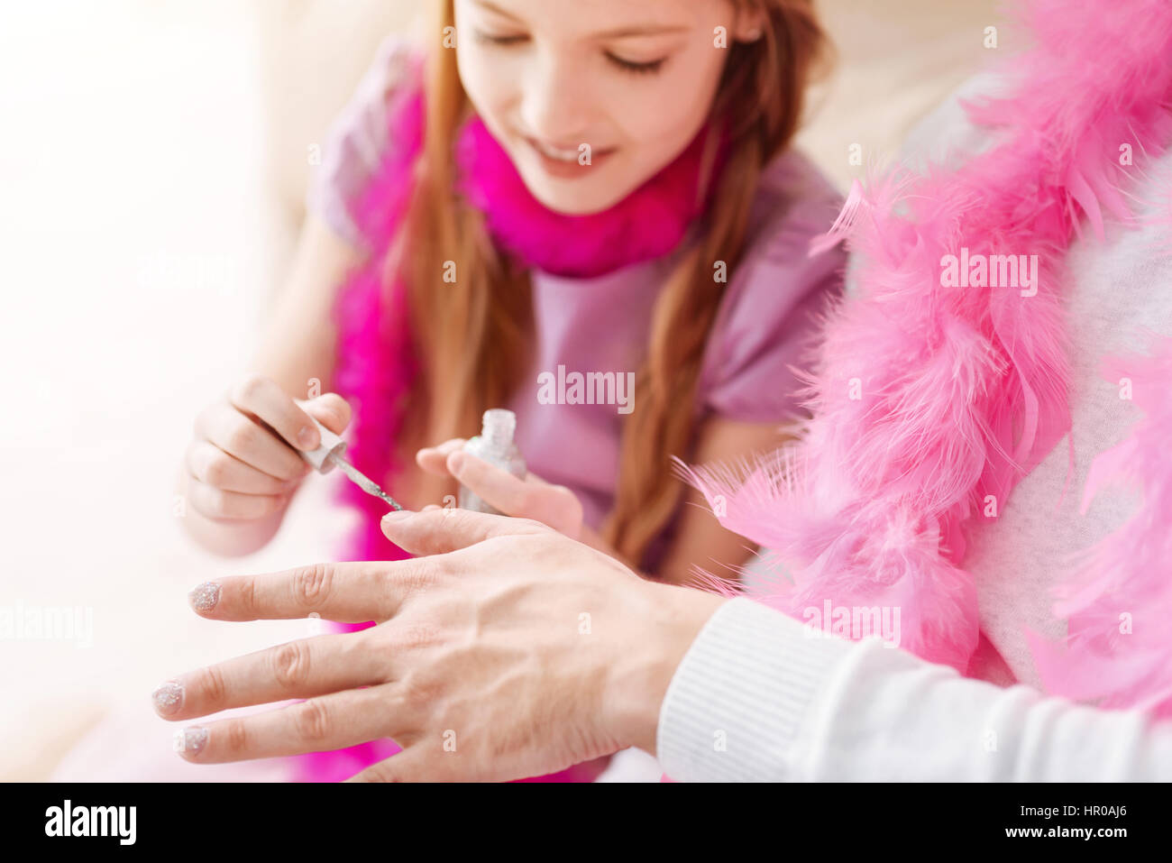 Be very attentive. Positive little female keeping smile on her face ...