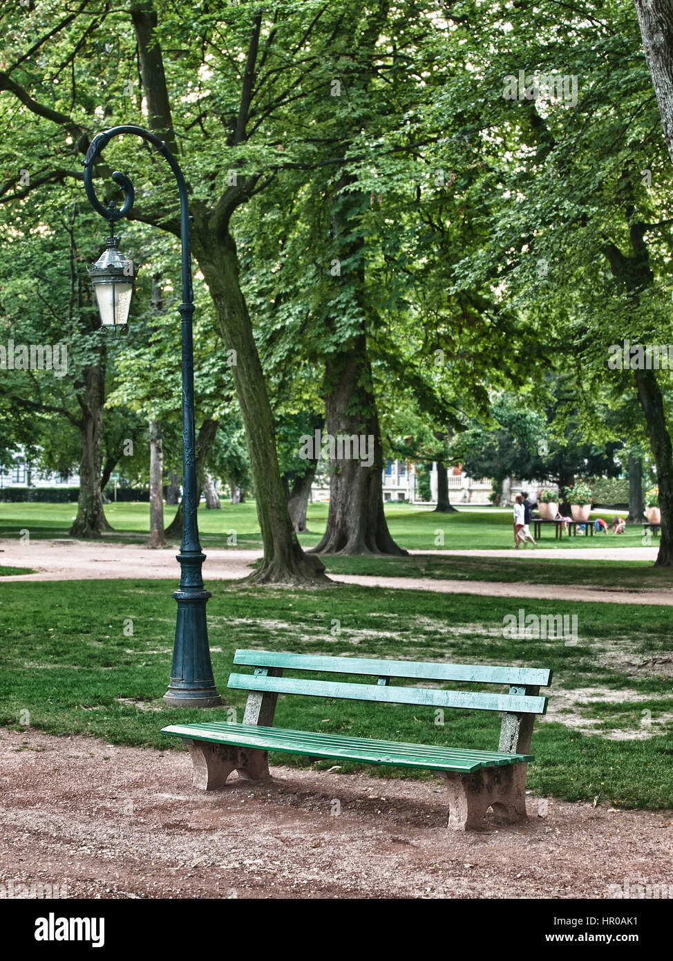 Green bench in peaceful park in Annecy Stock Photo - Alamy