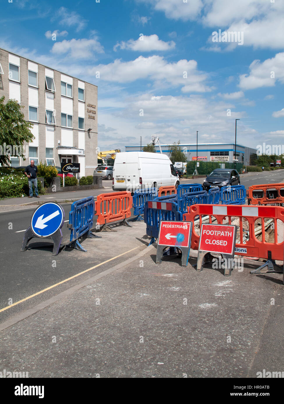 Road works with safety barriers blocking pedestrian footpath Stock ...