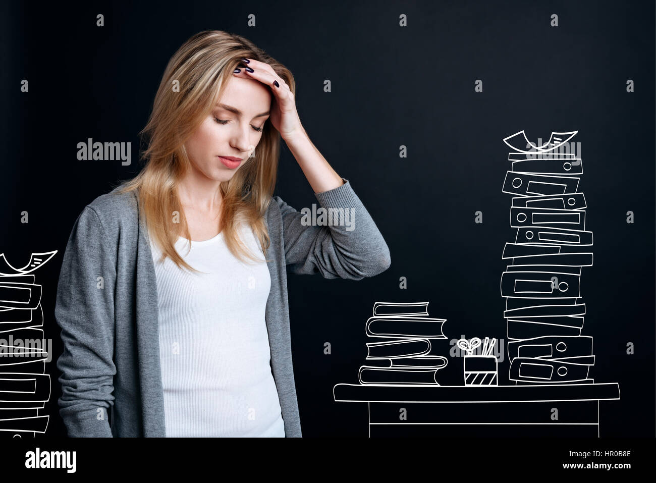 Too much studying. Hard working tired unhappy student holding her head ...