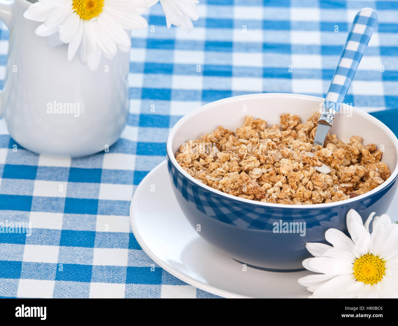 Breakfast cereal on the table with milk and flowers Stock Photo - Alamy