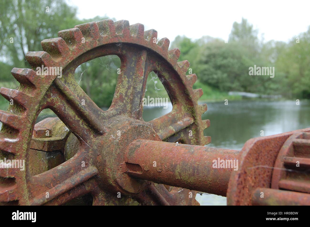 Mill machinery overlooking reservoir Stock Photo - Alamy