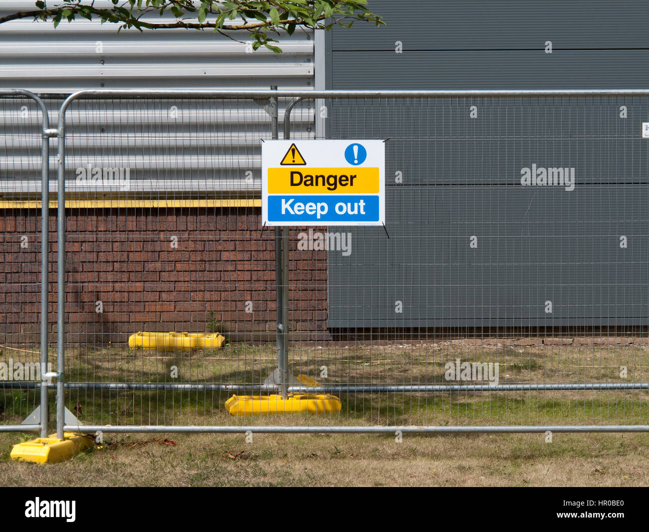 Danger keep out sign and barriers to building site refurbishing ...