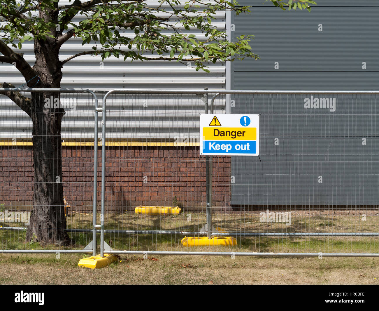 Danger keep out sign and barriers to building site refurbishing ...