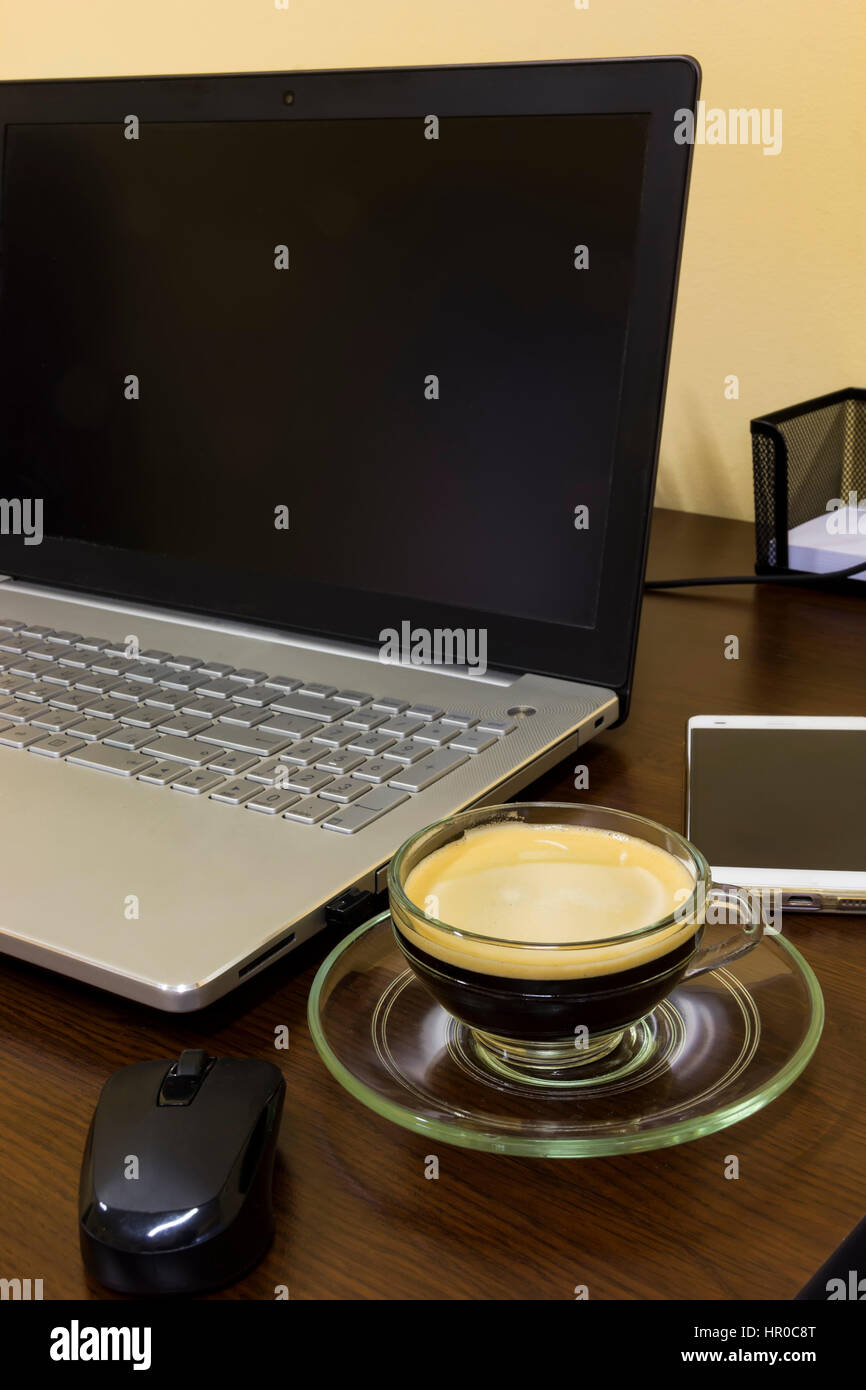 Comfortable working place in office with mouse,telephone and cup of ...