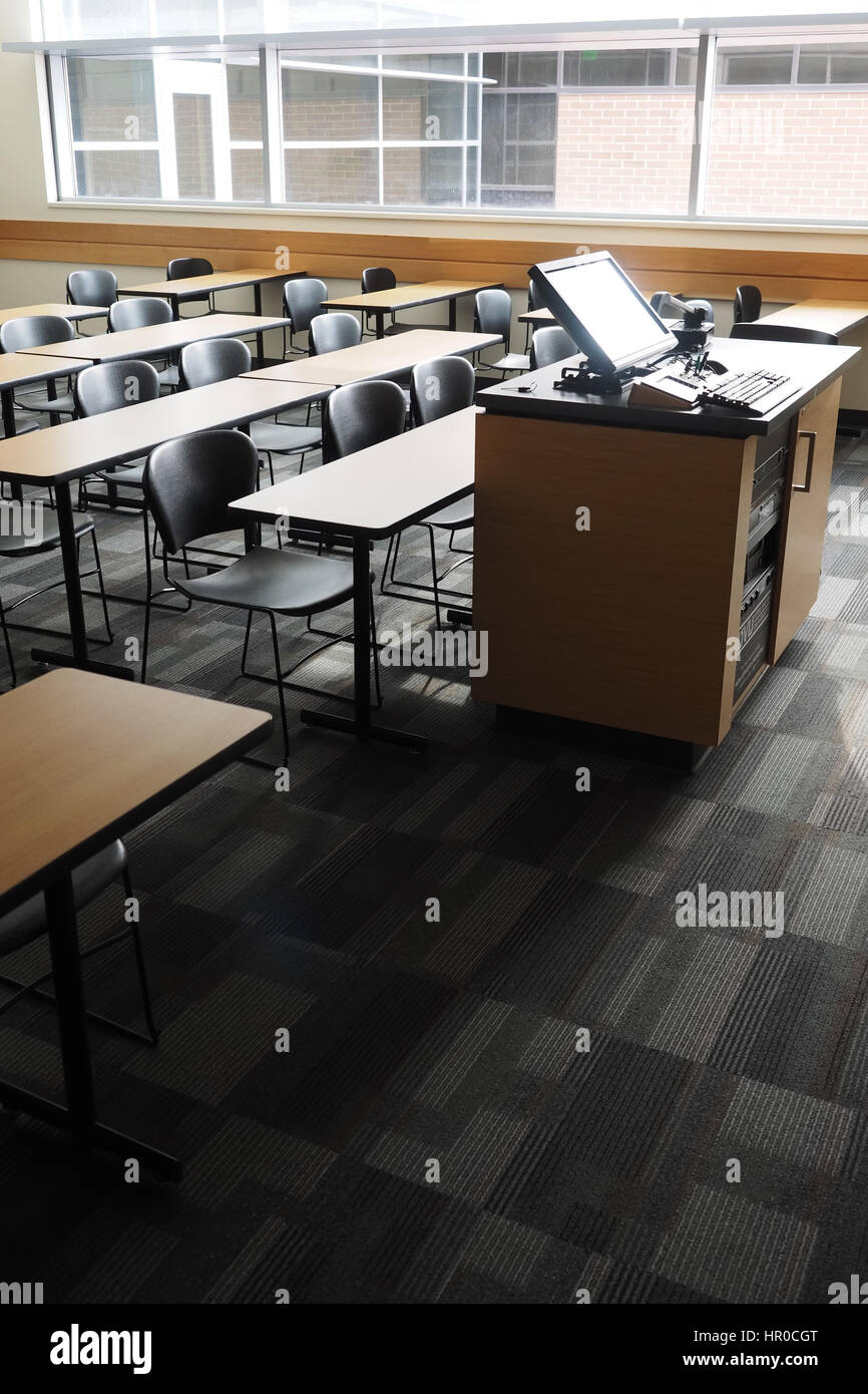 Empty classroom with student seating or desks Stock Photo - Alamy
