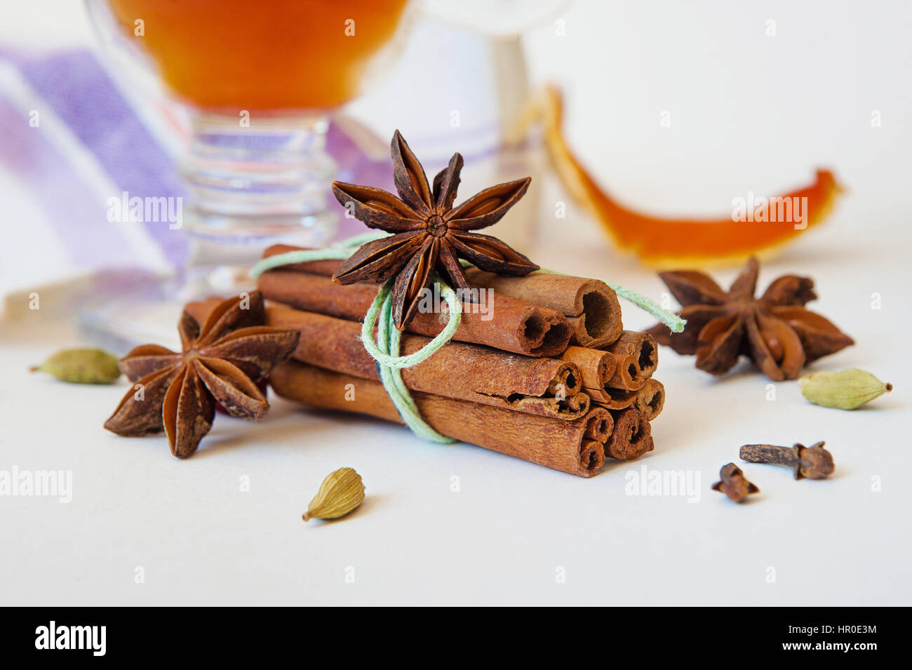 Collection of spices for mulled wine and pastry on the white table ...
