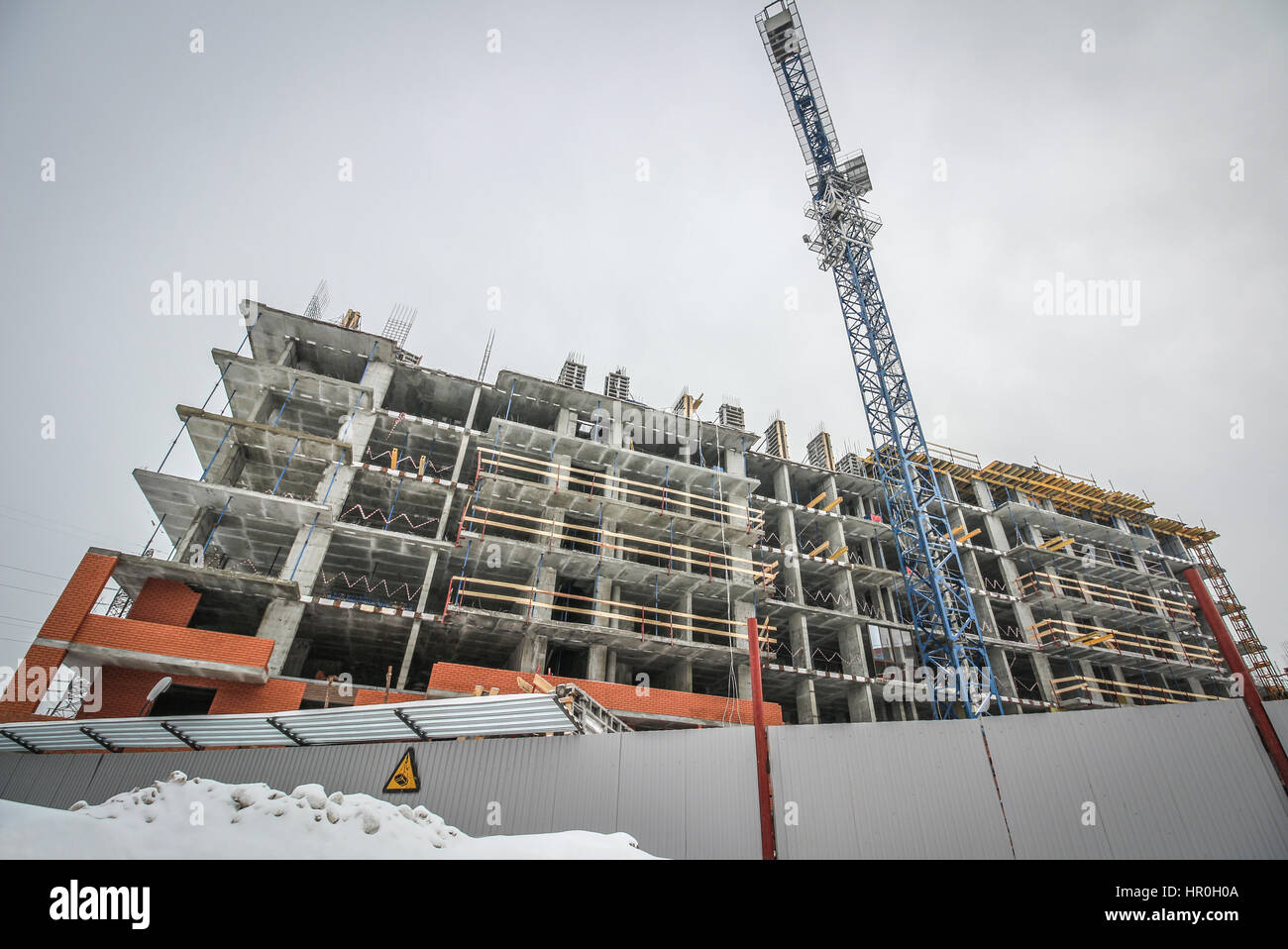 Construction of high-rise building in the winter Stock Photo - Alamy