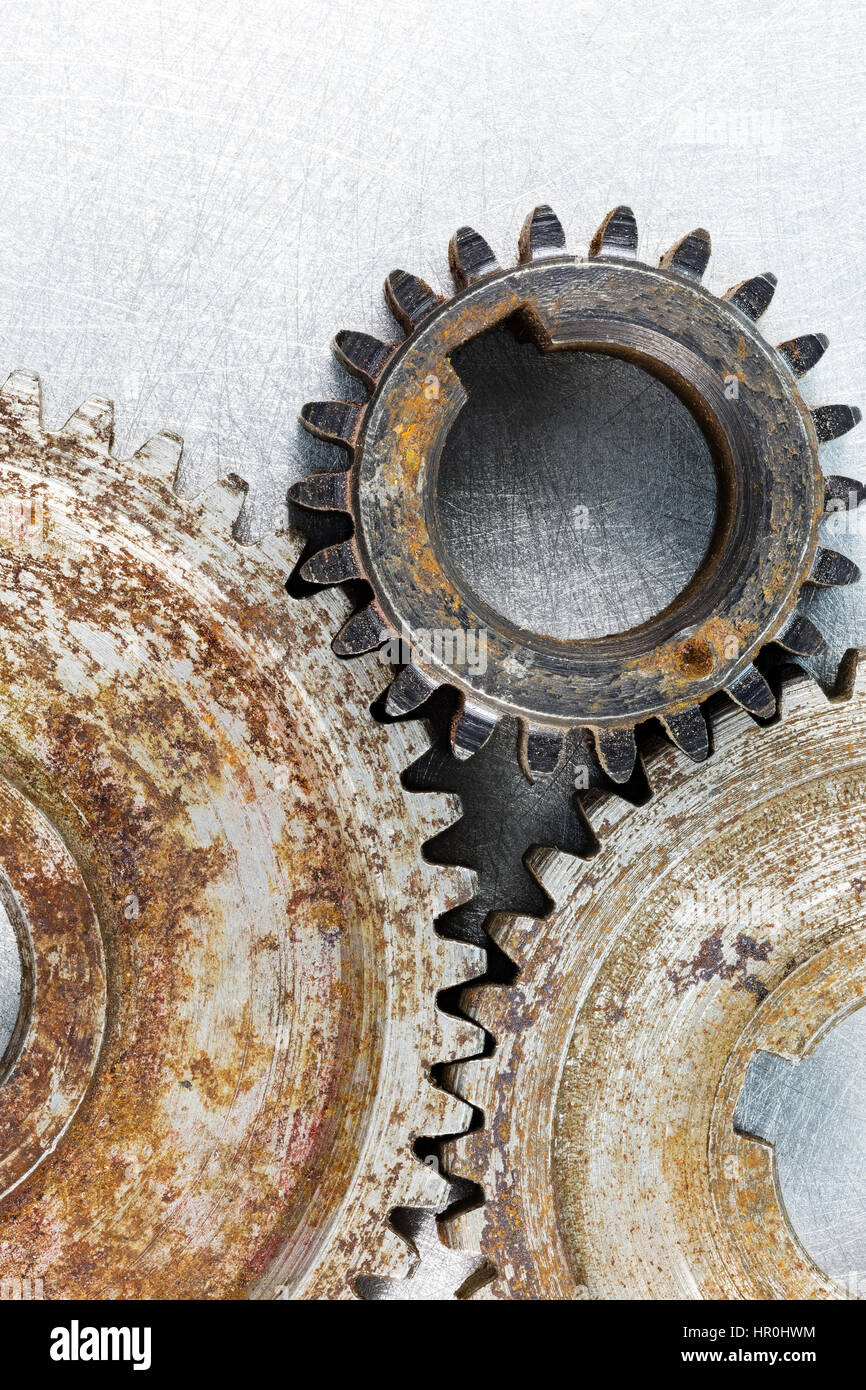 old rusty mechanical gears on scratched metal background, top view ...