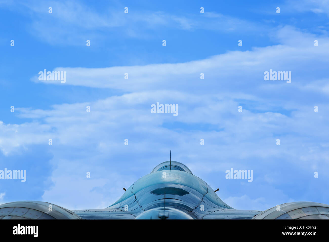 Military jet plane view of the tail close-up on a background of blue ...