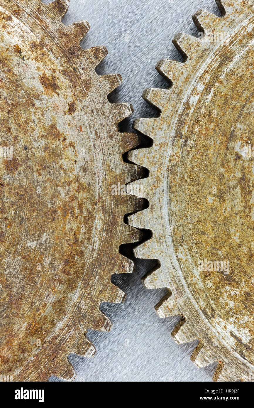 grunge corroded gears on scratched metal industrial background, top ...