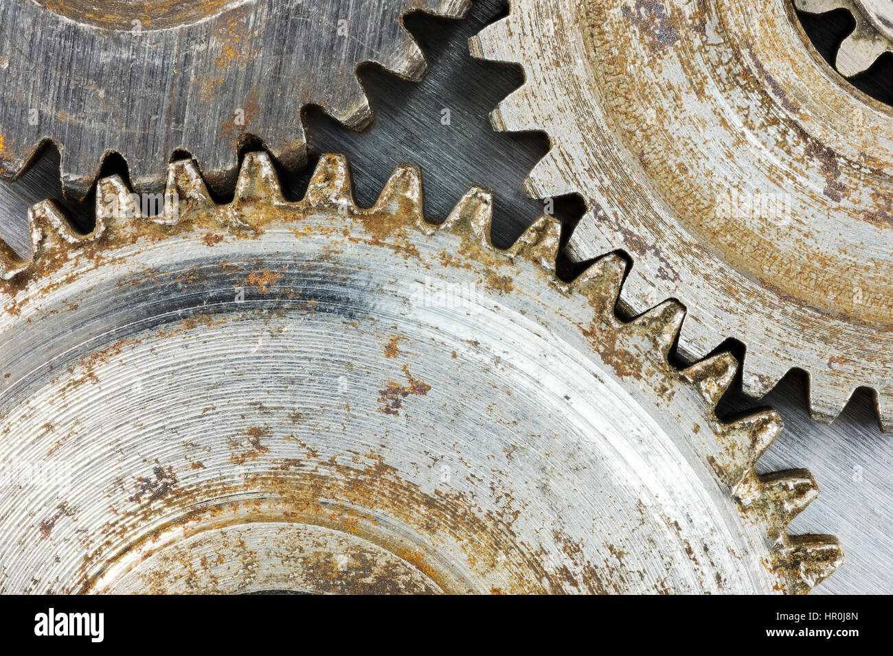old metal gear cogwheels with rust on scratched industrial background ...