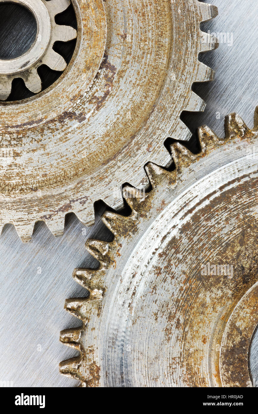 old gears with rust on scratched industrial background macro flat Stock ...