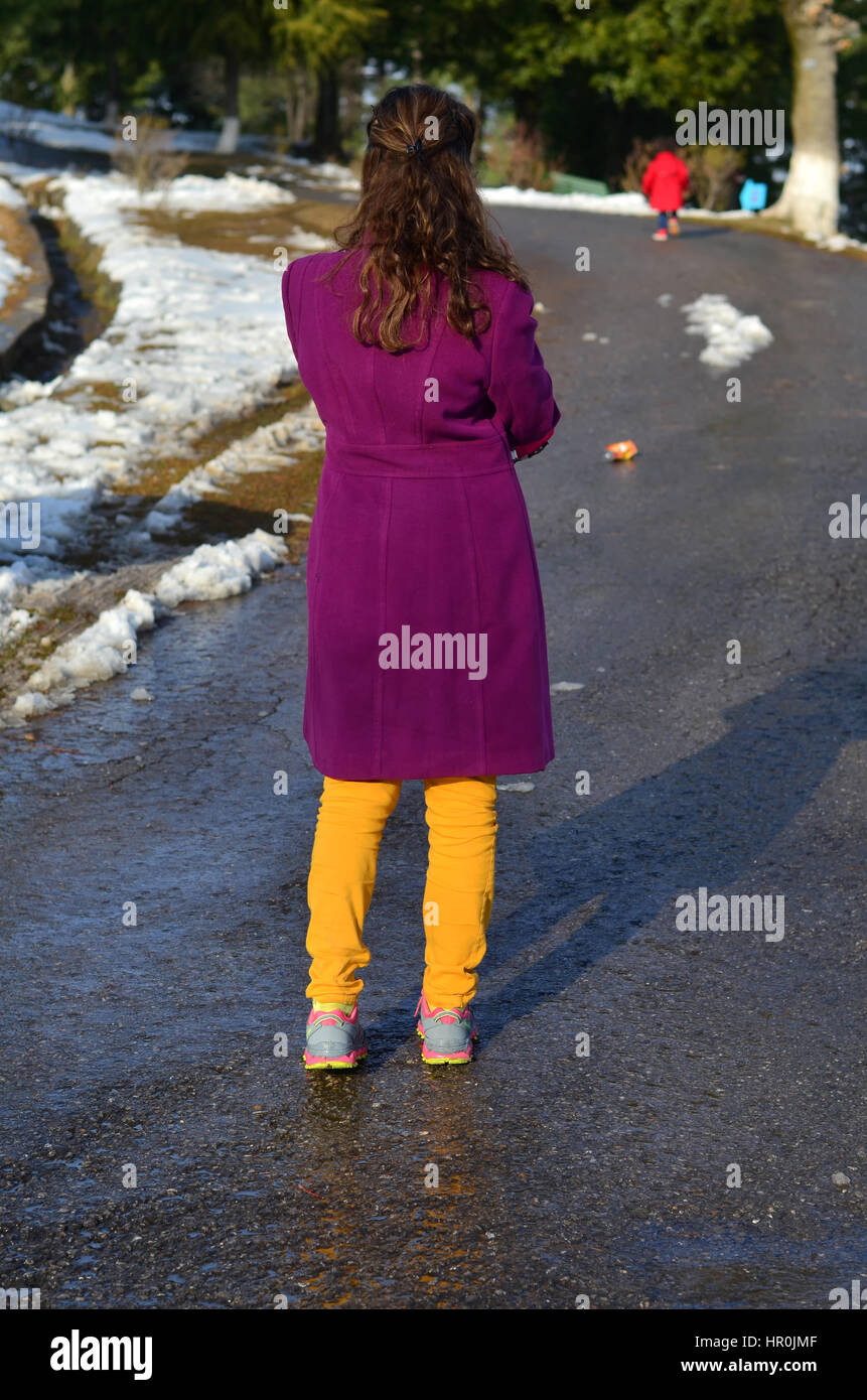 A teenage girl standing on the road Stock Photo - Alamy