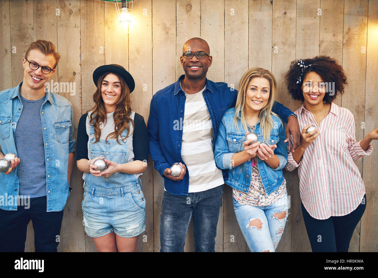 Group of five young good looking people in casual wear standing at ...