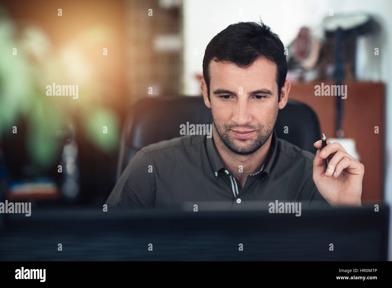 Confident businessman sitting desk office thinking hi-res stock ...