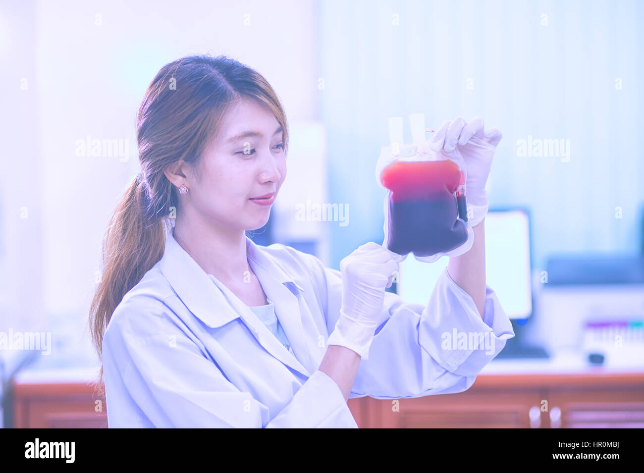 Bag of Blood in hand asian woman Doctor Stock Photo - Alamy