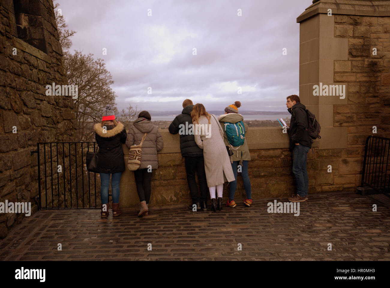 Edinburgh castle tourists on the ramparts inside the castle taking ...