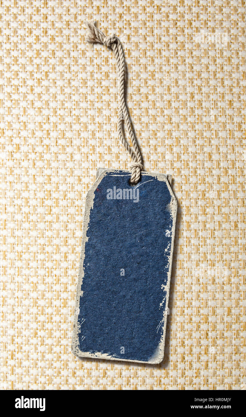 Blue blank paper label on textile background Stock Photo - Alamy