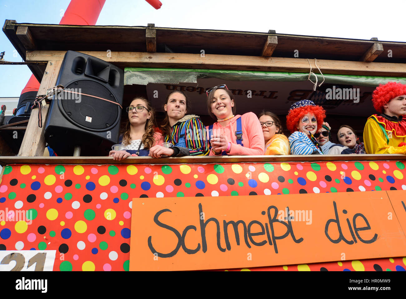 Neuoetting, Germany-February 25, 2017: Women look down from a float ...